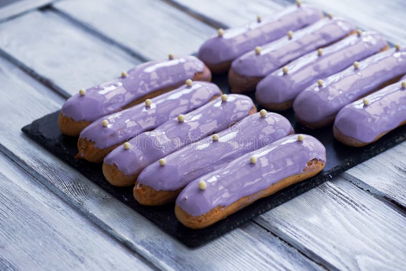 Eclairs, Filled with Purple Frosting. a Work of Culinary Art Stock ...