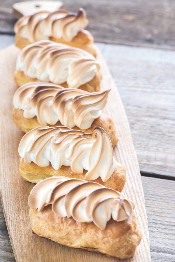 Eclairs with Lemon Curd and Meringue Stock Photo - Image of group ...