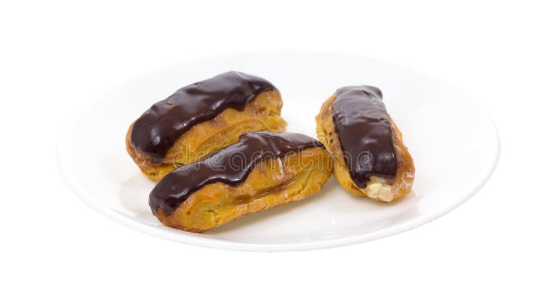Eclairs on Plate stock photo. Image of brown, custard - 21388010