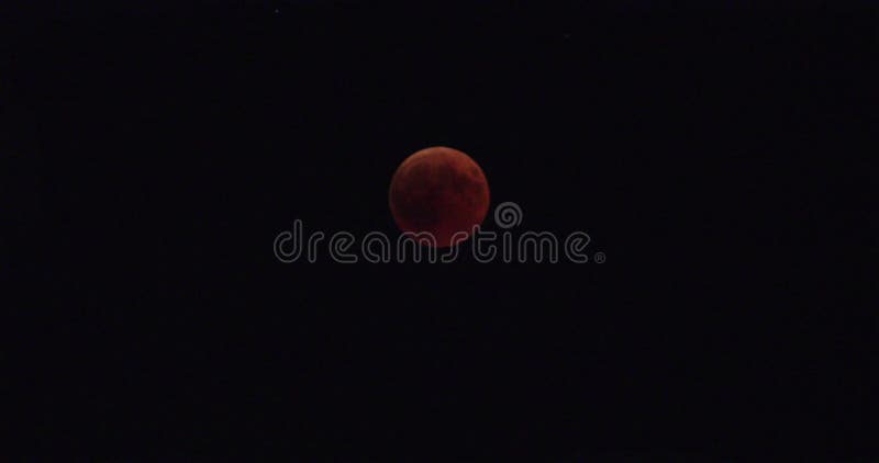 Eclipse lunar rojo total metrajes. Vídeo de lunar, oscuro - 137375658