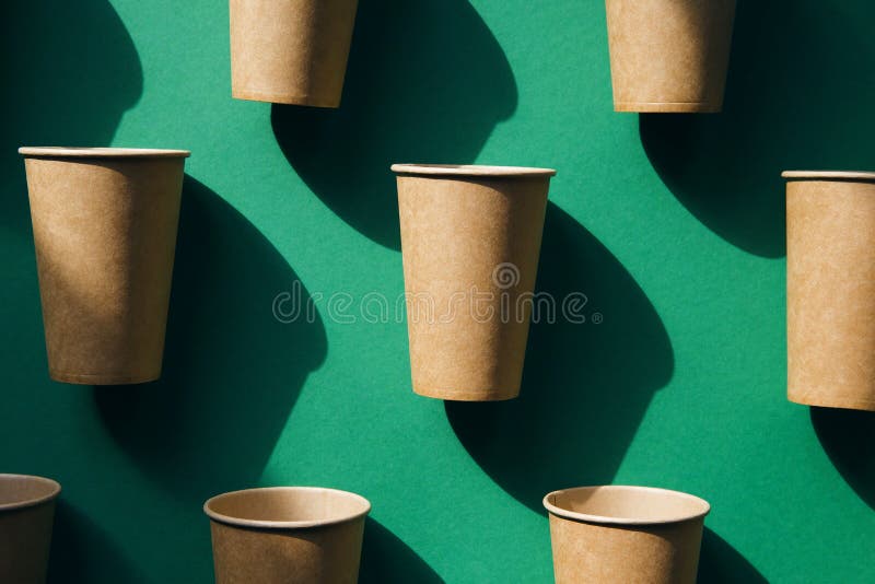 Eco Friendly Craft Paper Cups on Green Background Stock Photo - Image ...