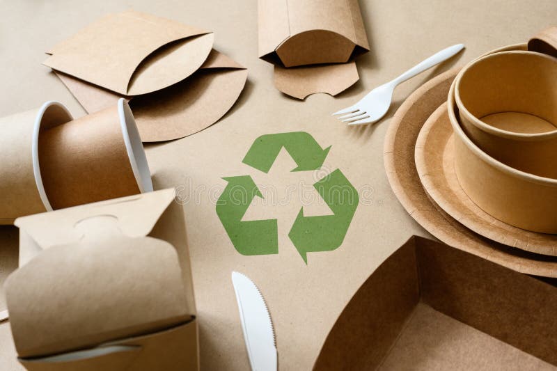 Eco Friendly Disposable Tableware on Craft Paper with a Recycling Sign ...