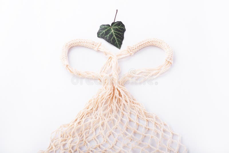 Eco Friendly String Bag and Green Leaf on White Background, Responsible ...