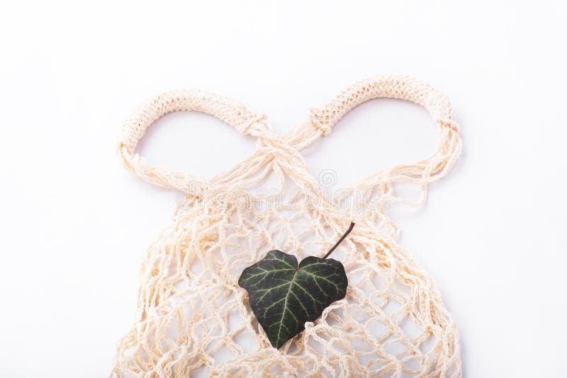 Eco Friendly String Bag and Green Leaf on White Background, Responsible ...