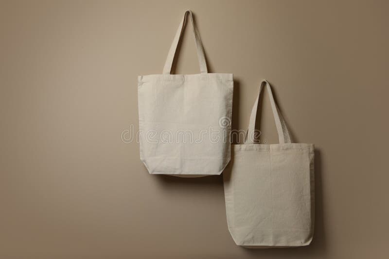Eco Tote Bags Hanging on Color Wall. Stock Photo - Image of grocery ...