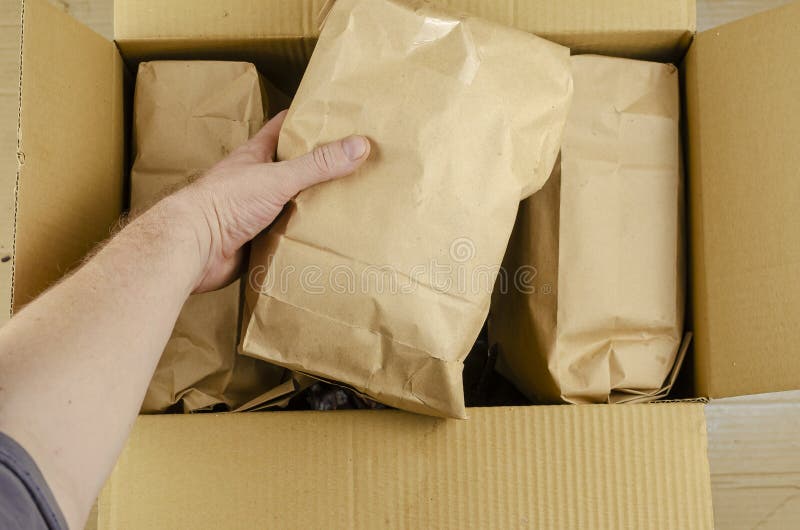 Ecological Packaging and Wrapping Concept. Hand Pulls a Paper Bag Out ...