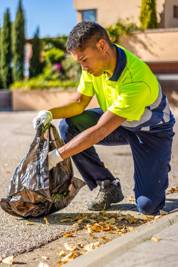 Ecologist Man Collecting Garbage. Guy Picking Up Trash Outdoors Stock ...
