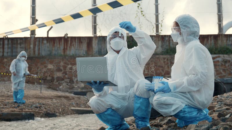 Ecologist Sampling Water from the River with Test Tube and Save Data To ...