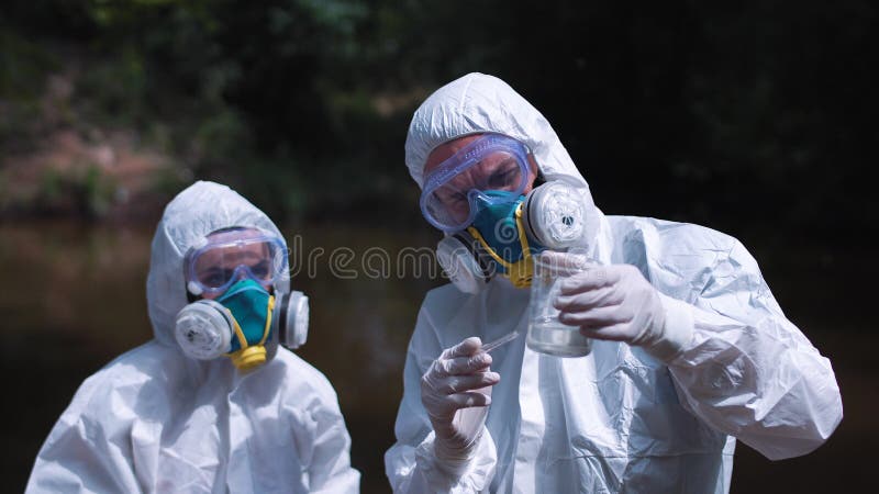 Ecologists in Protective Suits Doing Experiment Stock Photo - Image of ...
