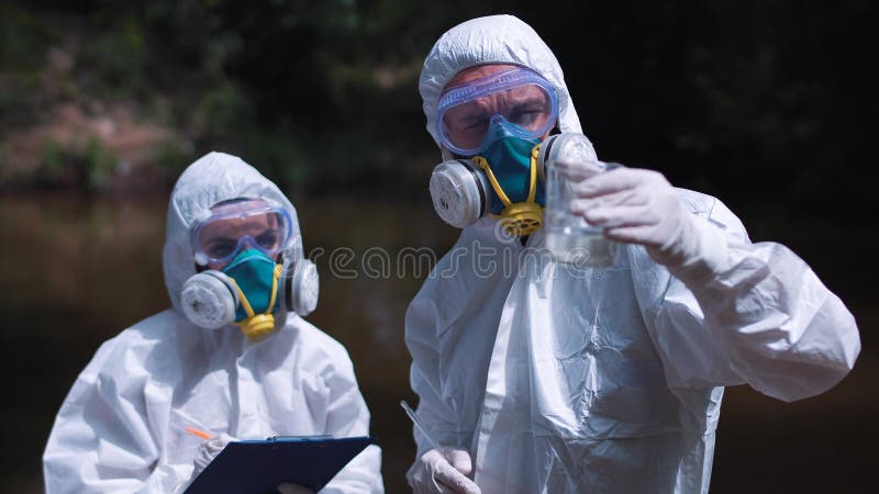Ecologists in Protective Suits Doing Experiment Stock Photo - Image of ...