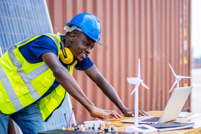 Ecology Engineer Typing on Laptop and Working on Project. on Desk are ...