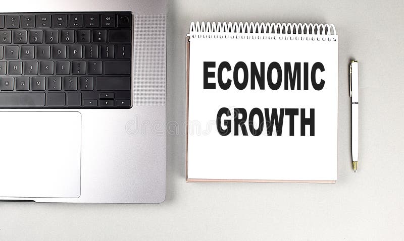 ECONOMIC GROWTH Text on Notebook with Laptop and Pen Stock Image ...