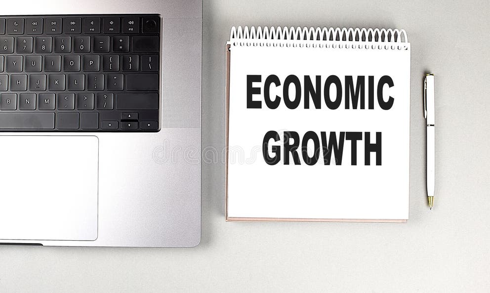 ECONOMIC GROWTH Text on Notebook with Laptop and Pen Stock Image ...