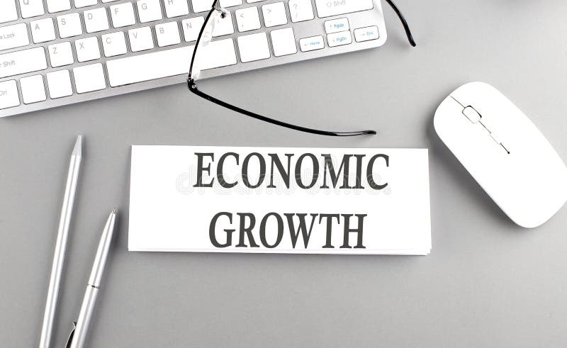 ECONOMIC GROWTH Text on Paper with Keyboard on Grey Background Stock ...