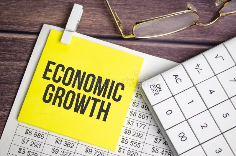 ECONOMIC GROWTH Text on Yellow Sticker and Charts Stock Photo - Image ...
