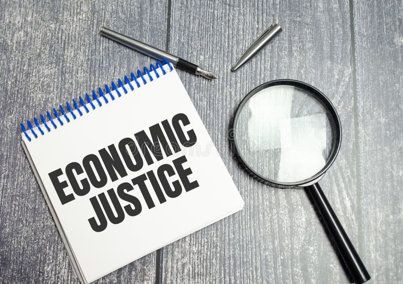 Economic Justice Words on White Notebook and Pen with Magnifying Glass ...