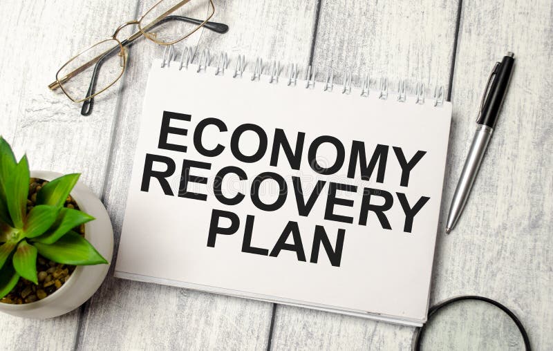 ECONOMY RECOVERY PLAN Words on Paper Notebook with Pen Stock Image ...
