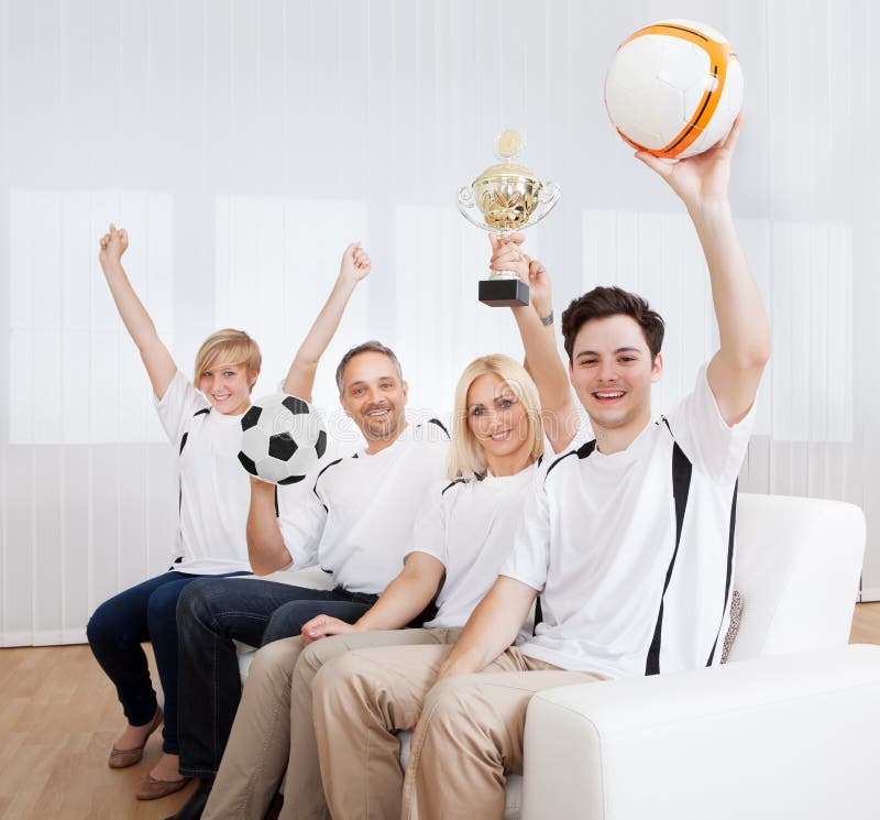 Ecstatic Family Celebrating a Win Stock Photo - Image of silver, living ...
