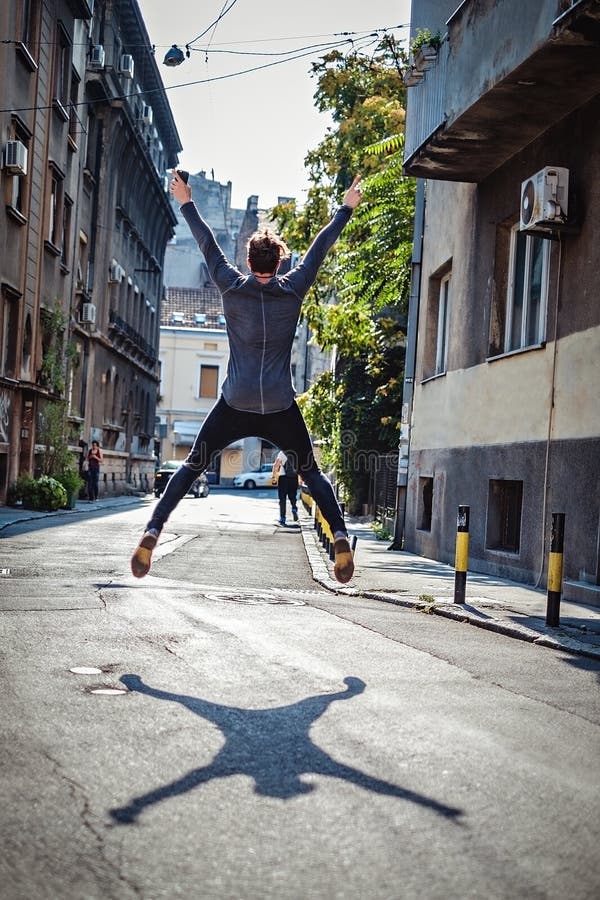 Ecstatic Man Jumping on the Street Stock Image - Image of expression ...