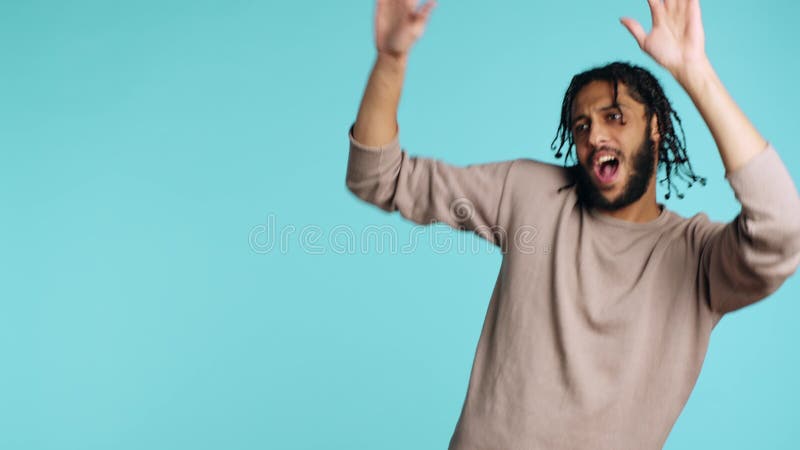 Ecstatic Person Has Fun, Throwing Hands in Air, Celebrating, Studio ...