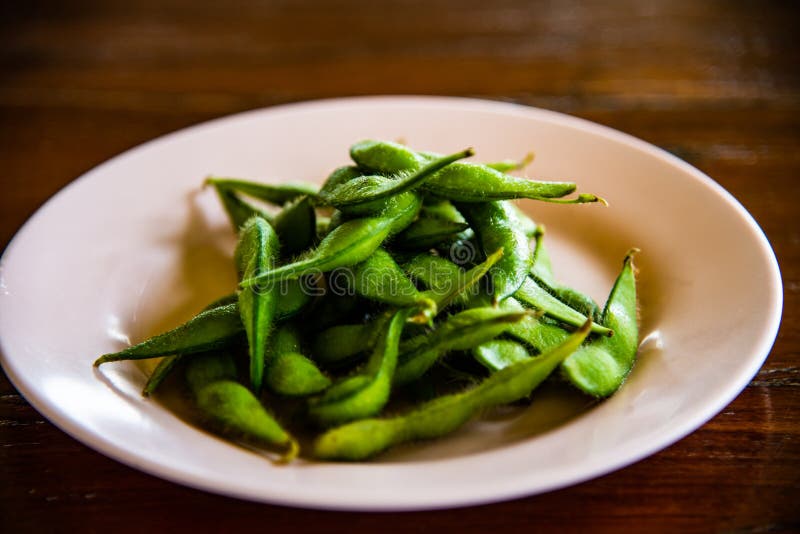 Edamame beans on a plate stock image. Image of salt - 263783553