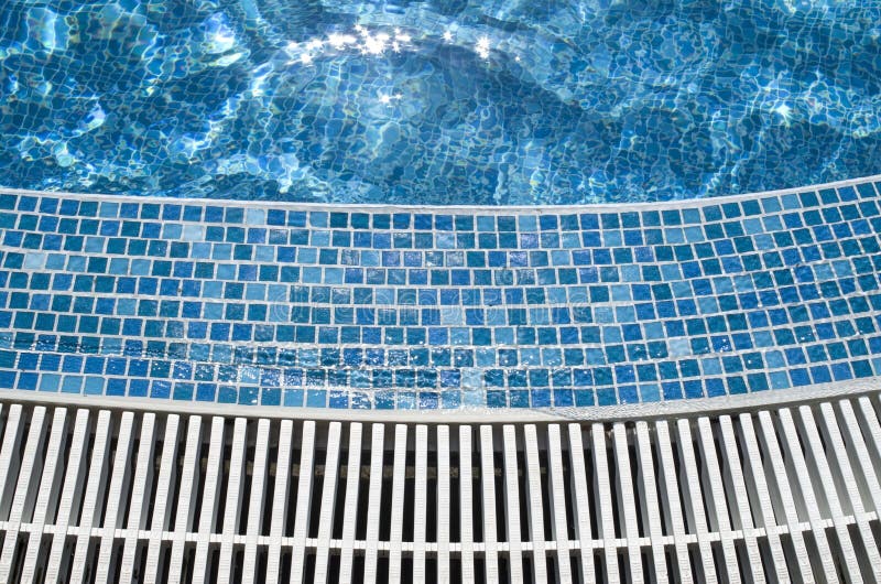 Edge Of Swimming Pool With Blue Mosaic Tiles Of The Pool. Stock Photo ...