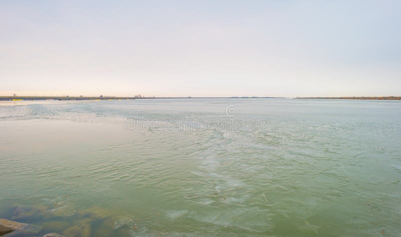 Edge of a Frozen Lake Along a in Winter Stock Photo - Image of pond ...