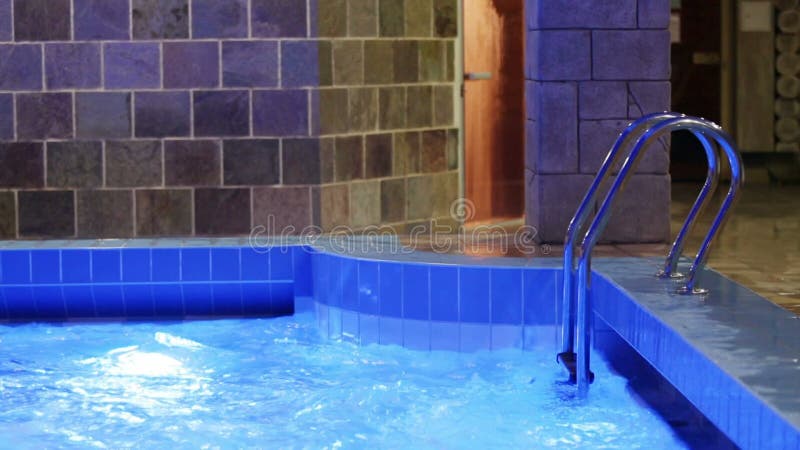 The Edge of Indoor Swimming Pool with Ladder and Stock Footage - Video ...