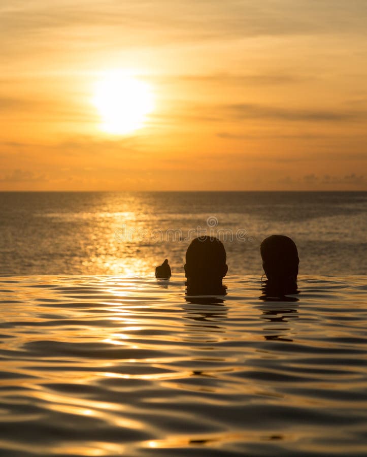 Infinity Edge Pool with Sea Underneath Sunset Stock Image - Image of ...