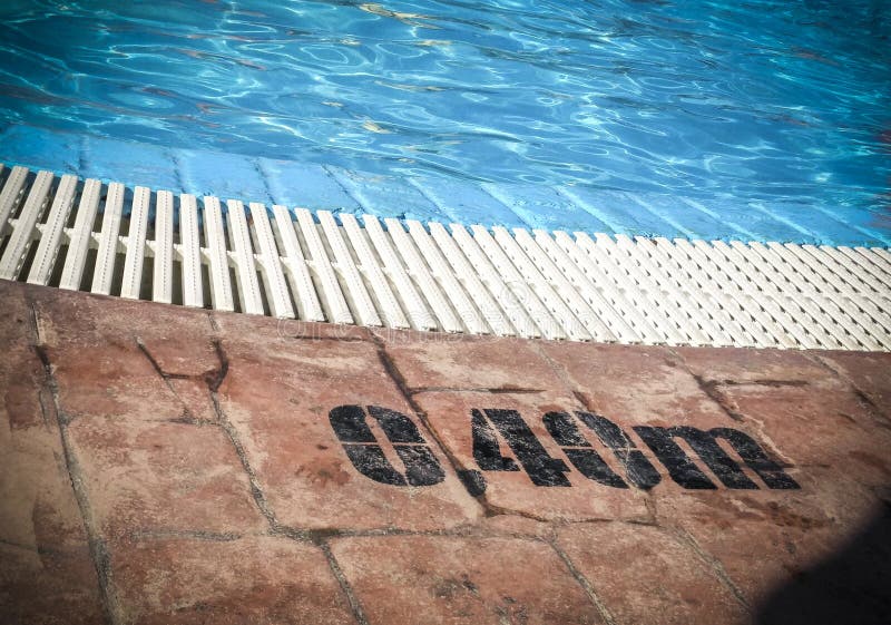 Edge of a swimming pool stock photo. Image of aquatic - 262075914