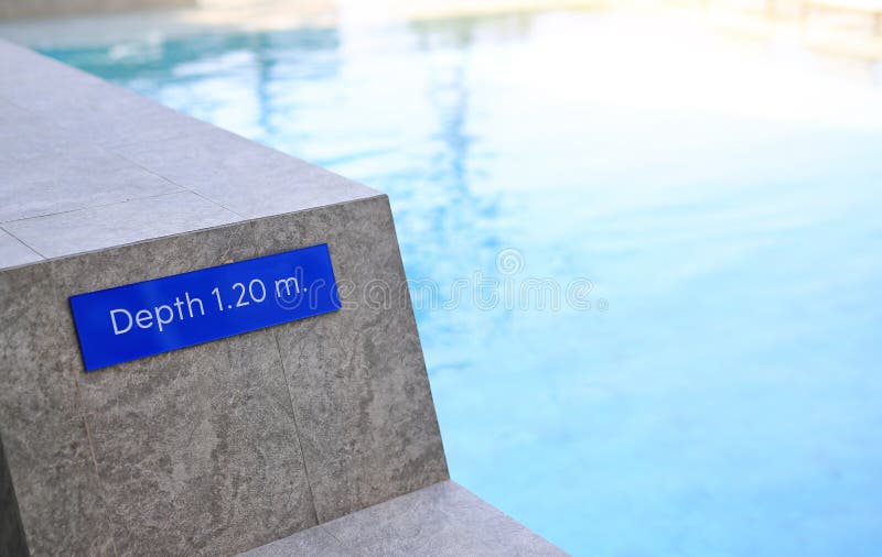 Edge of Swimming Pool and Sign Indicating the Depth 1.20 Meter of the ...