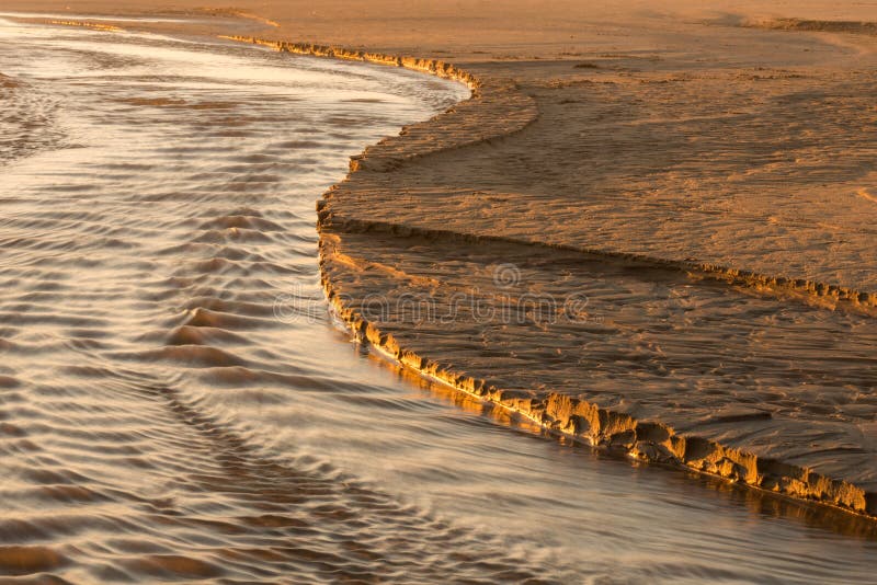 Edge of the Water Formed by Sand Against Retreating Ocean Stock Image ...