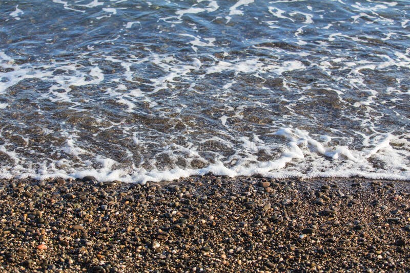 Edge of the Water on a Pebble Beach Stock Photo - Image of edge, island ...