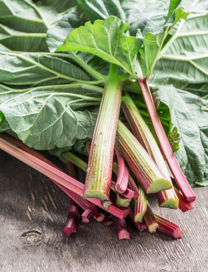 Edible Rhubarb Stalks on the Wooden Table Stock Photo - Image of leaf ...