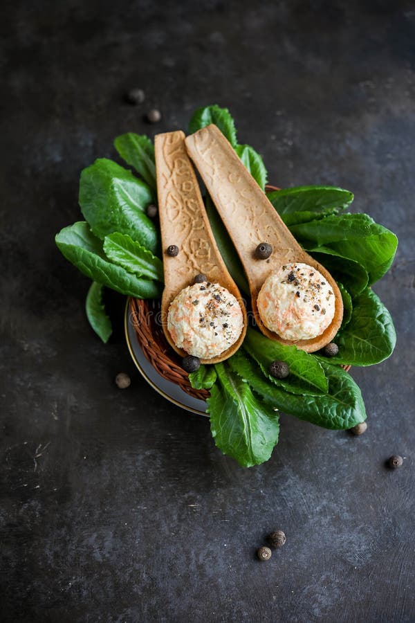 Edible Spoons with Cheese Balls and Fresh Herbs on a Dark Table. Stock ...