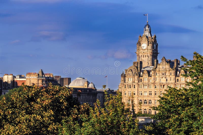 Edinburgh Cityscape with Clock Tower at Sunset Amidst Greenery Stock ...