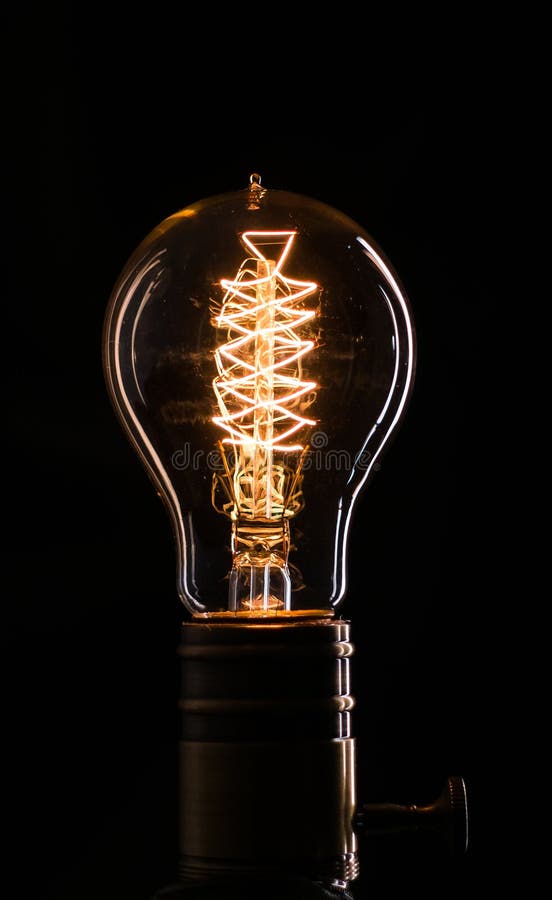 Edison`s Light Bulb Illuminates from Electric Current Stock Photo ...