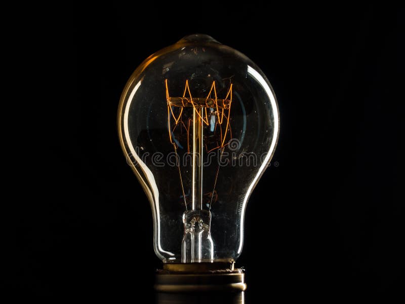 Edison`s Light Bulb Illuminates from Electric Current Stock Photo ...