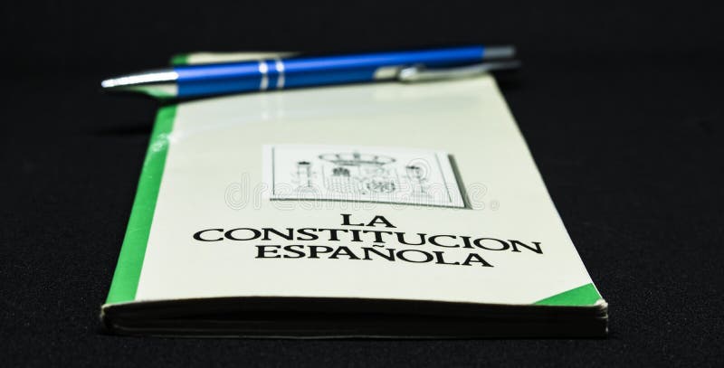 Book of the Spanish Constitution Wiht a Pen and the Graphical White ...