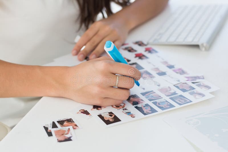 Editor Working at Her Desk Marking a Contact Sheet Stock Photo - Image ...