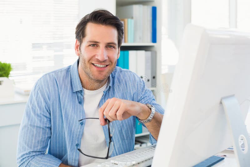 Editor Working at His Computer while Looking at Camera Stock Image ...