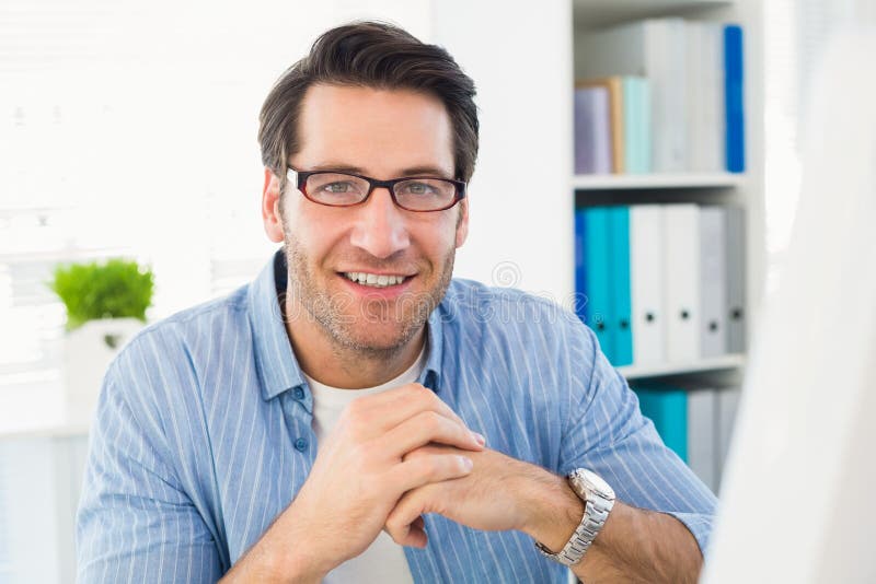 Editor Working at His Computer Smiling at Camera Stock Image - Image of ...