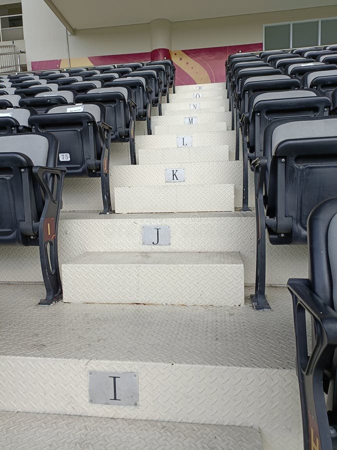 Rows of Black Stadium Seats with Numbered Steps Editorial Photography ...