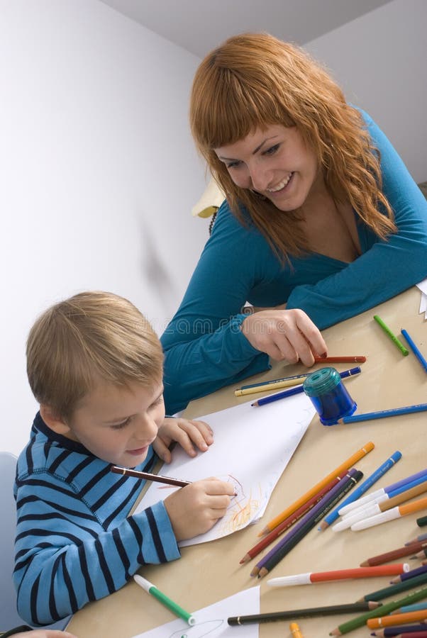 Adult Helping Two Young Children at Montessori/Pr Stock Photo - Image ...