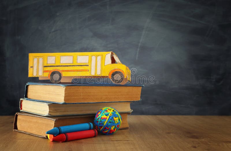 Education and Back To School Concept. Cardboard Bus and Books in Front ...