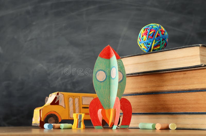Education and Back To School Concept. Cardboard Rocket, Bus, Books and ...