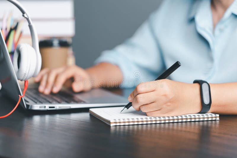 Education Concept. Close Up of Female Student Make Notes Hand Write in ...