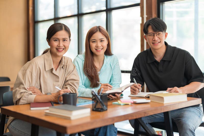 Education Concept, Female Tutor and Students Smiling and Looking on ...