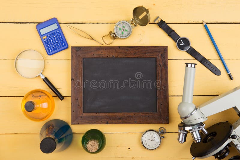 Education Concept - Notepad, Microscope on the Yellow Wooden Desk Stock ...
