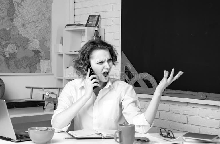 Education Concept. School Teacher Talking on Smartphone. Angry Tutor in ...
